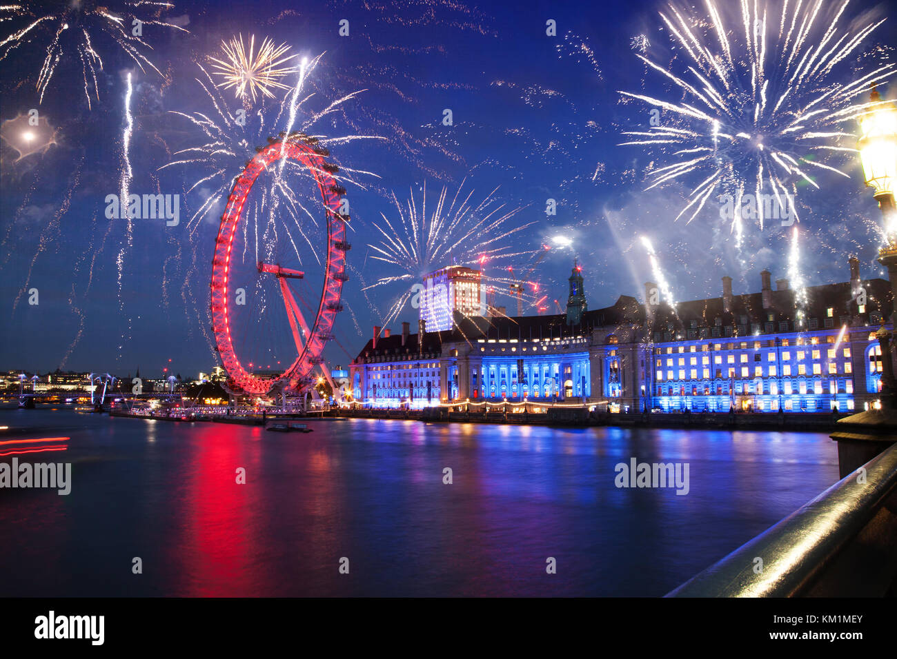 explosive fireworks display fills the sky around London eye. New Year's ...