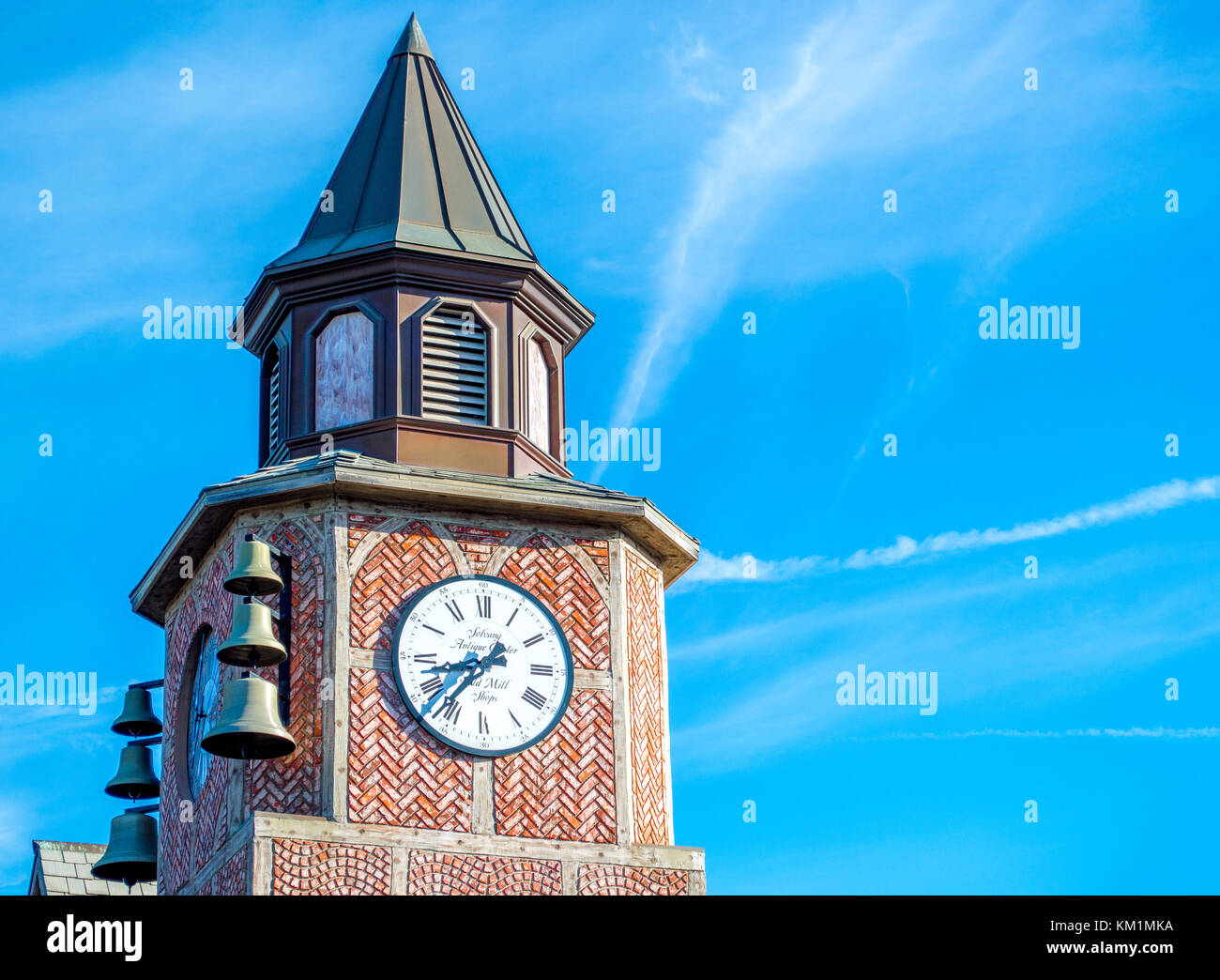 red brick tower with vintage clock and bells in Solvang, California, US ...