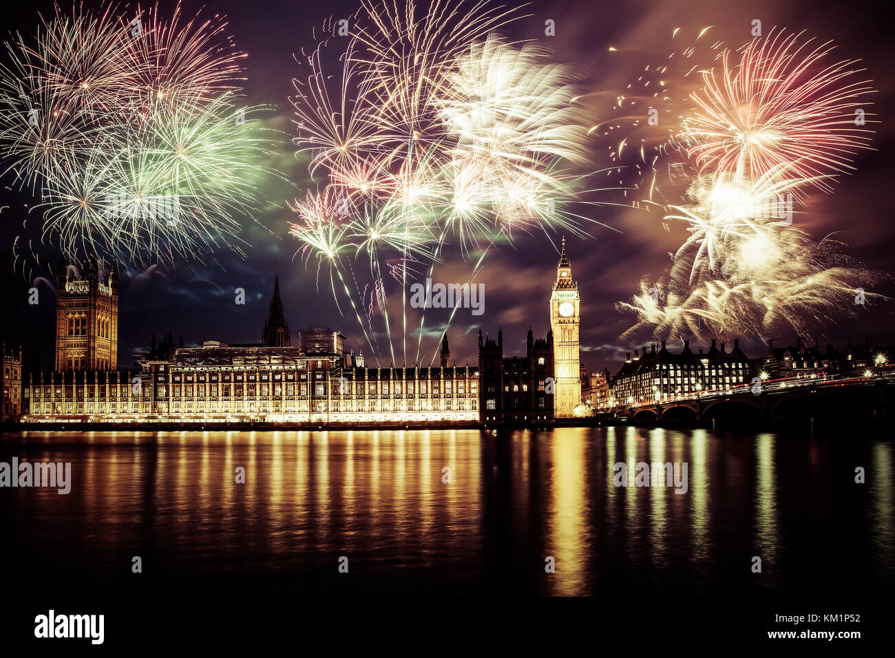 explosive fireworks display fills the sky around Big Ben. New Year's ...