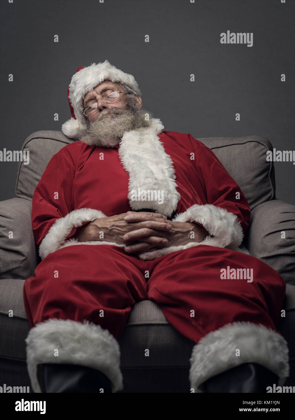 Sleepy Santa Claus taking a nap and relaxing on the armchair on ...