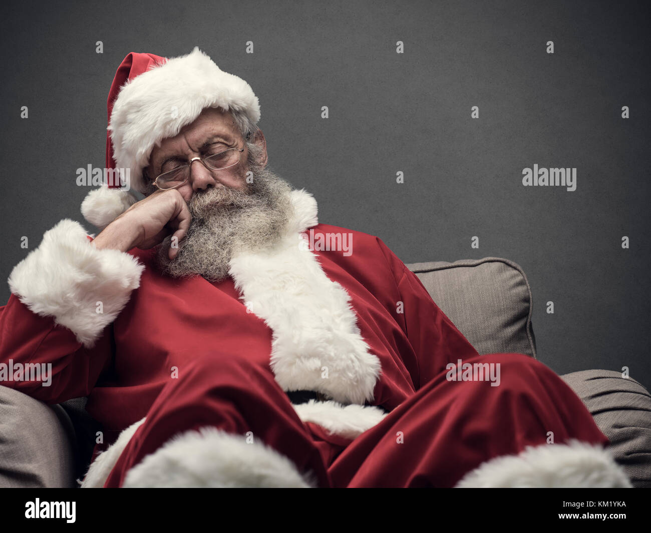 Sleepy Santa Claus taking a nap and relaxing on the armchair on ...
