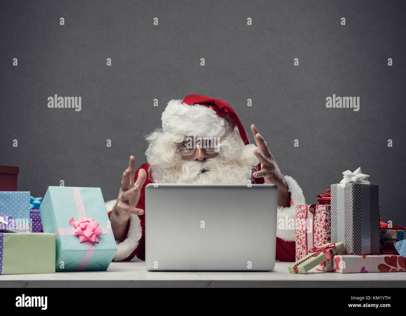 Angry frustrated Santa Claus yelling at the laptop on Christmas Eve ...