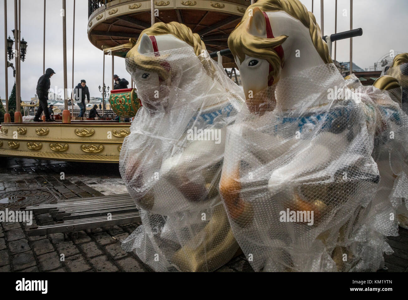 Preparing Christmas fair and carousel assembly on Manege square near ...