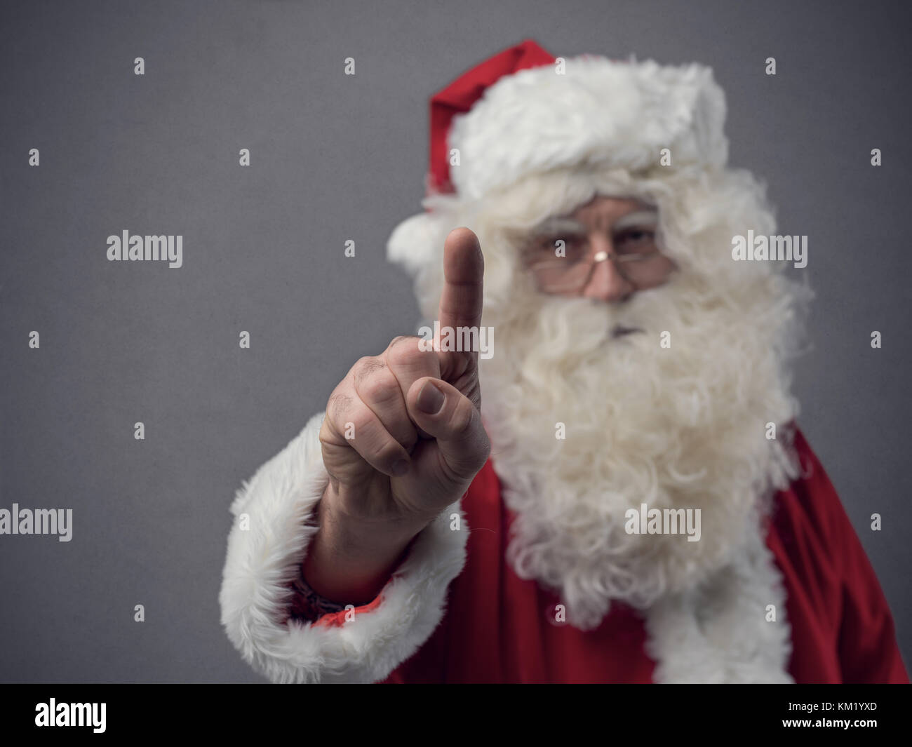 Santa Claus using an interactive touch screen user interface, he is ...
