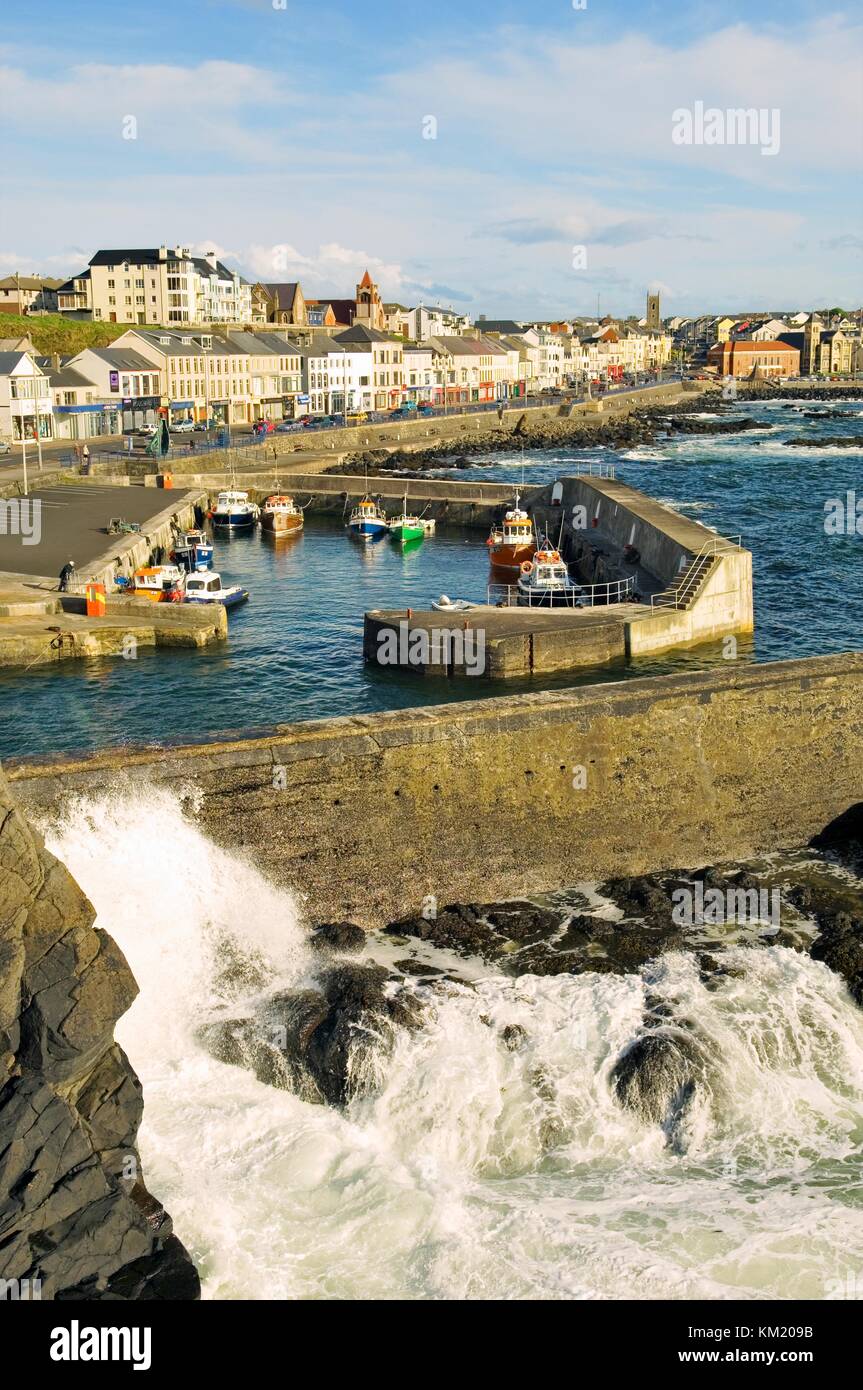 Portstewart fishing boat harbour and main street seafront, County Derry ...