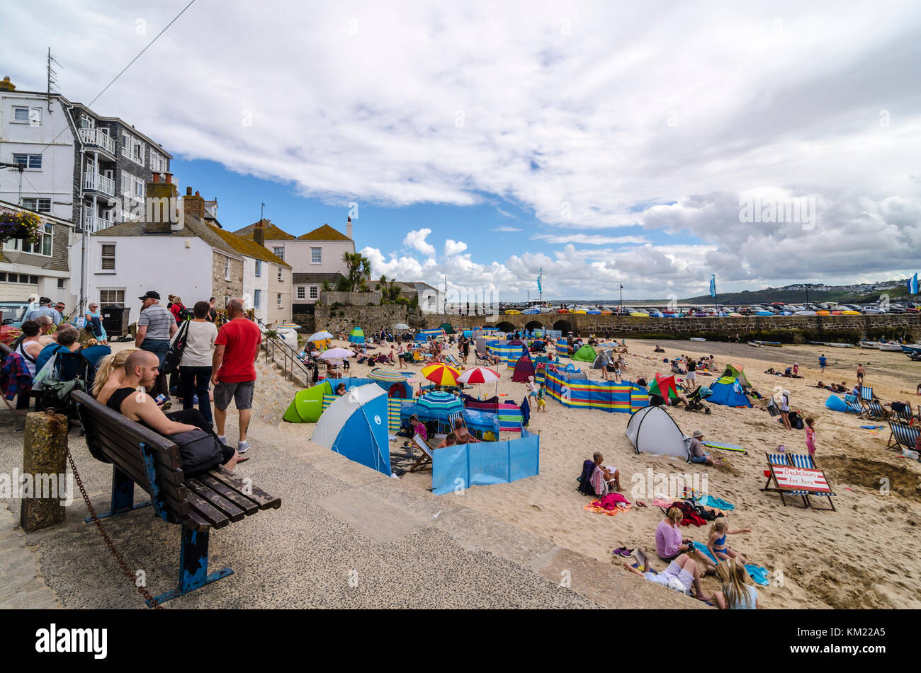 People and tourists on St Ives Harbour Beach, traditional English ...