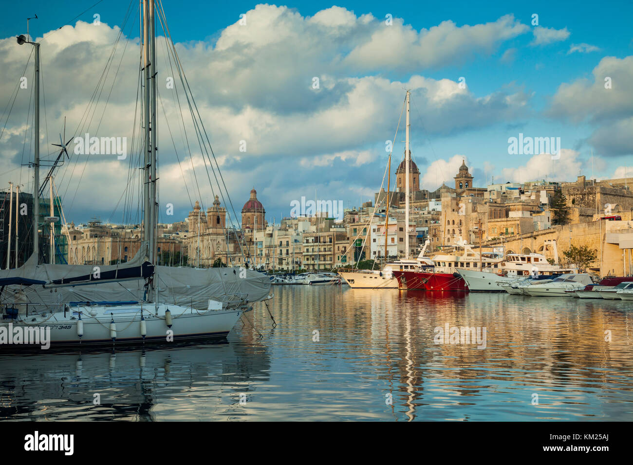 Sunset at Vittoriosa Yacht Marina on Malta. The skyline of Il Birgu in ...