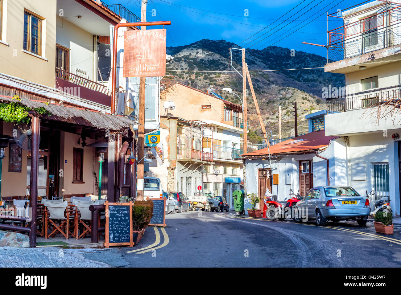 AGROS, CYPRUS - JANUARY 29, 2016: Looking down the main street in Agros ...