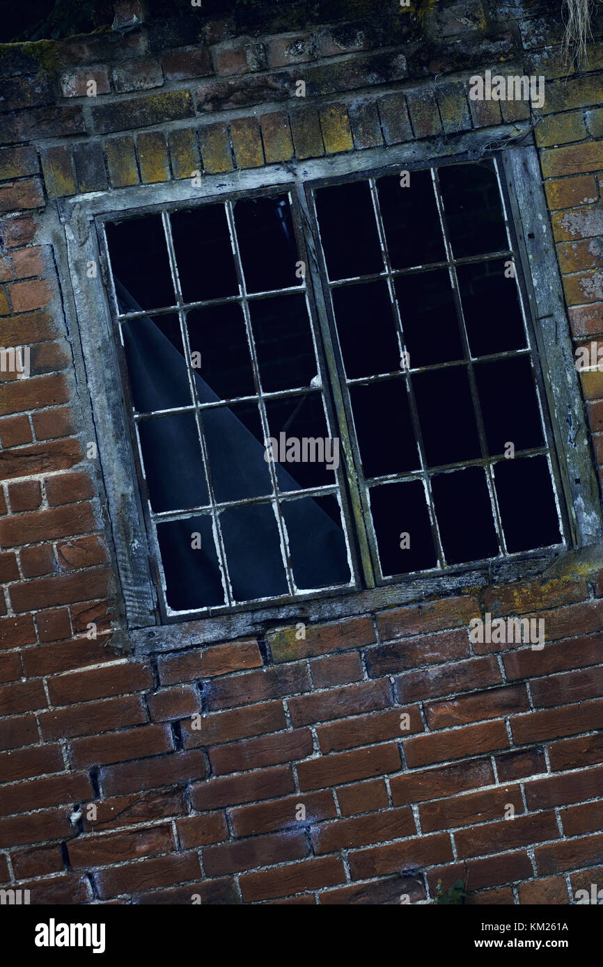 An old broken window frame surrounded by red bricks Stock Photo - Alamy