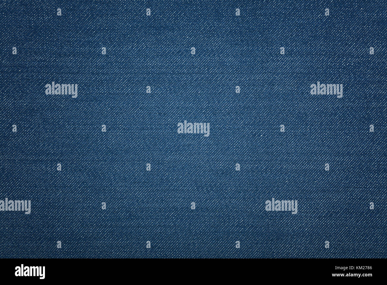 Dark indigo blue washed cotton jeans denim texture background, close up ...