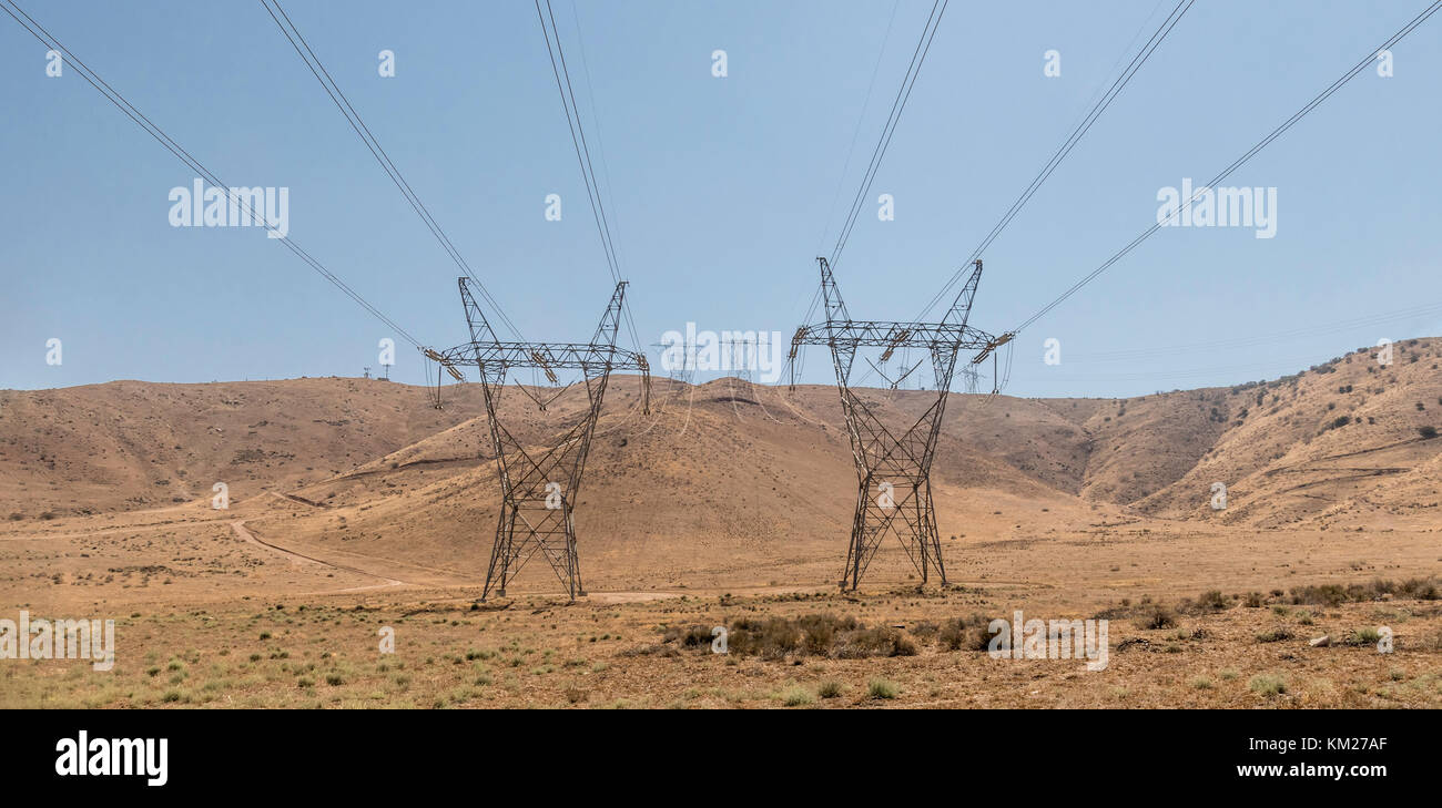 High voltage power transmission lines in the dry desert of California ...