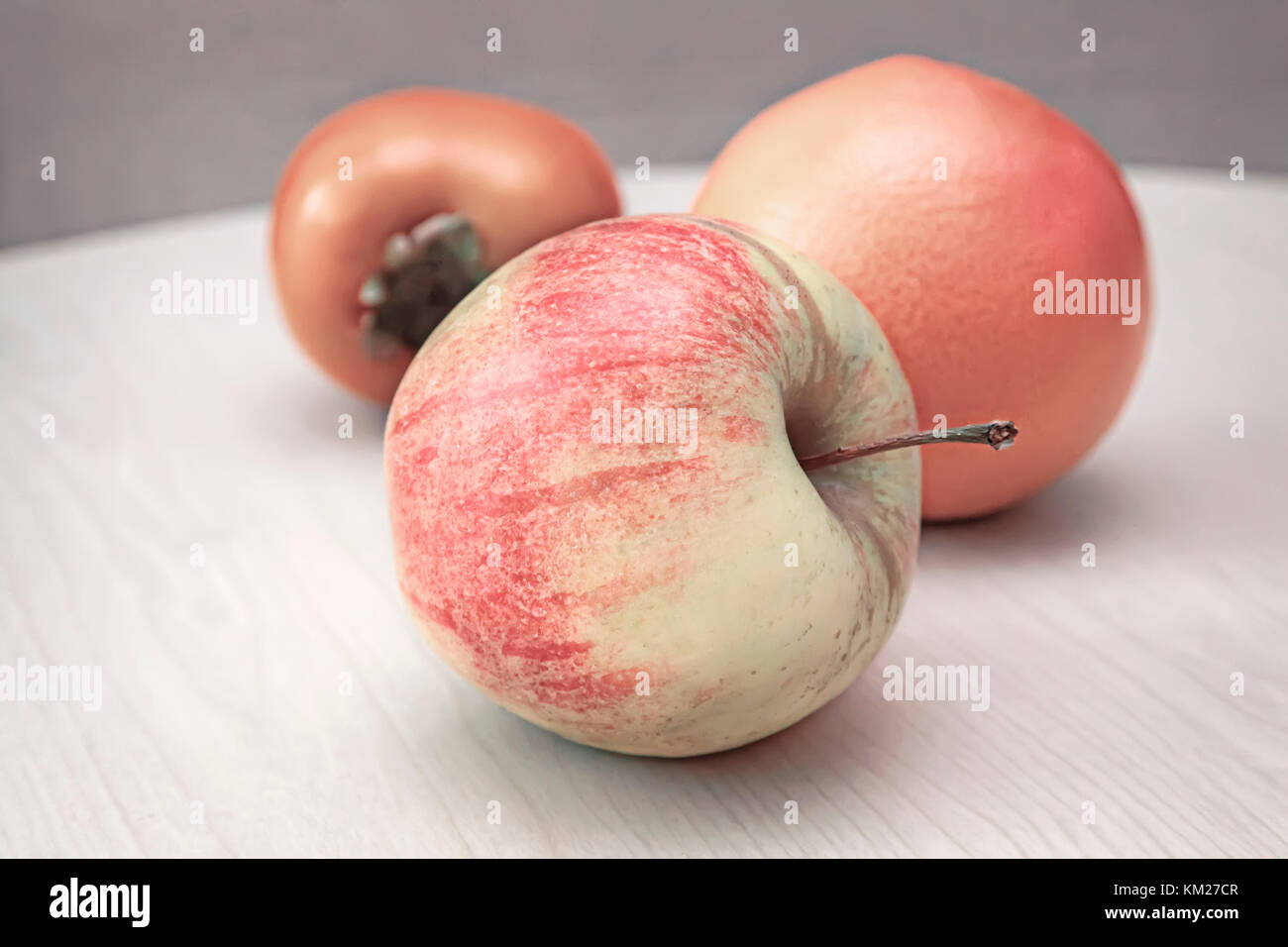 Fruits: Apple, grapefruit, and persimmons Stock Photo - Alamy