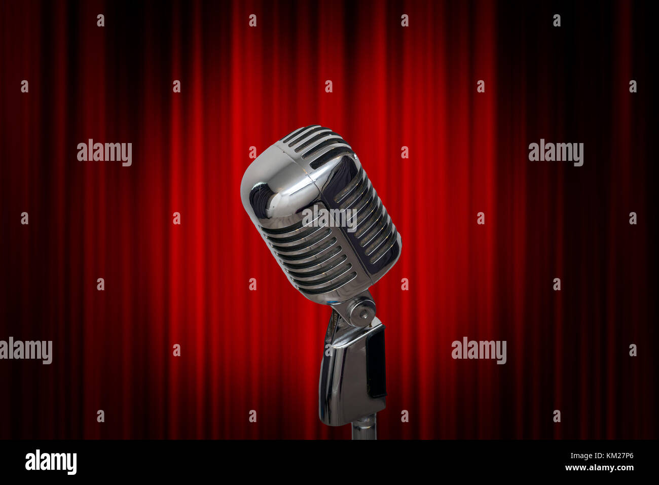 Retro microphone over the red curtain background, vintage musical ...