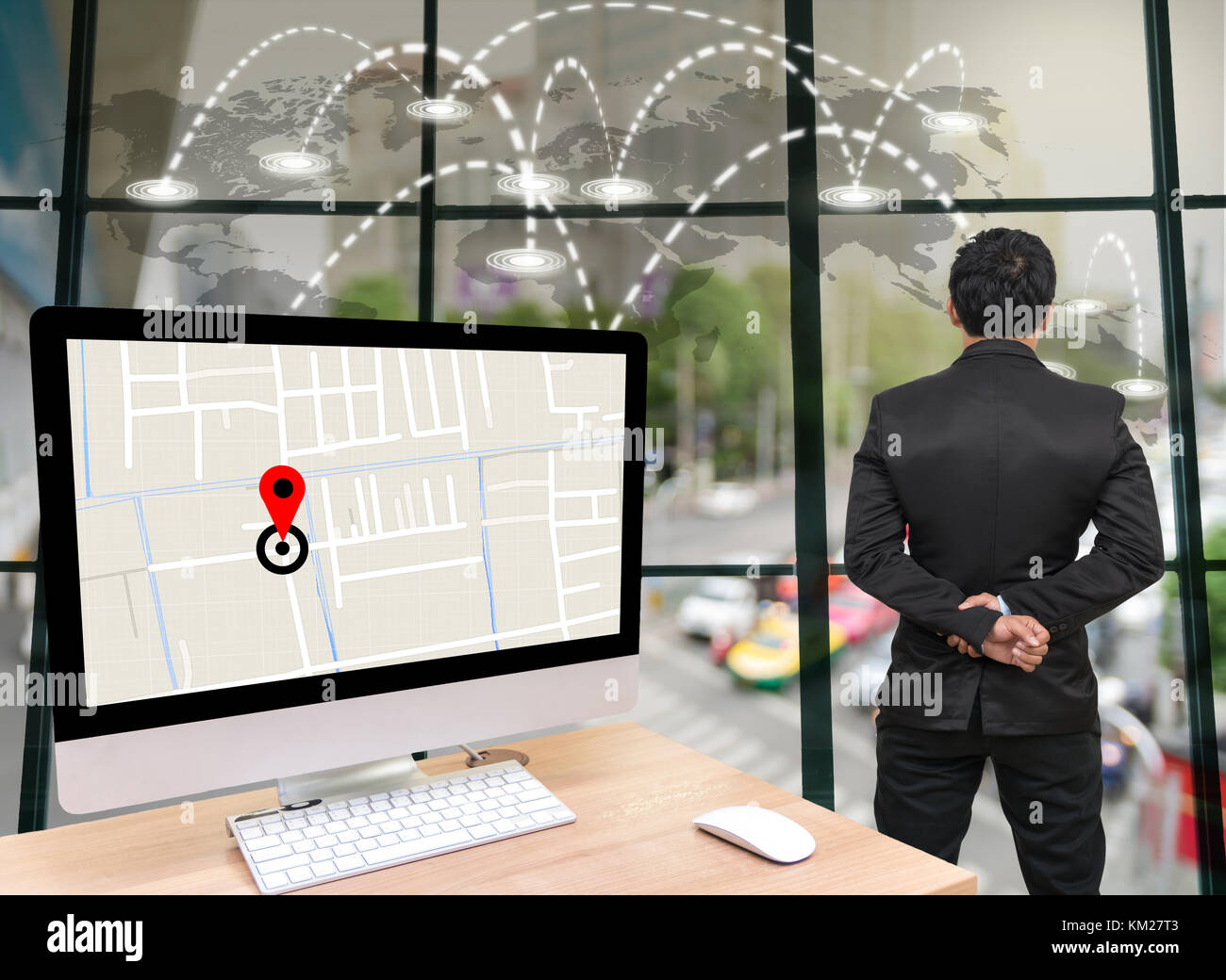 Back side of Businessman looking at traffic jam with Computer on desk ...