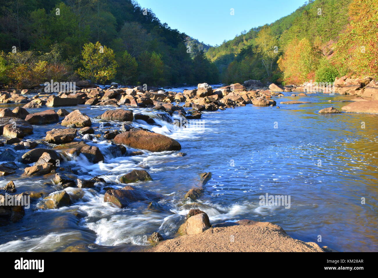 landscape with a stream flowing over rocks. long exposure Stock Photo ...