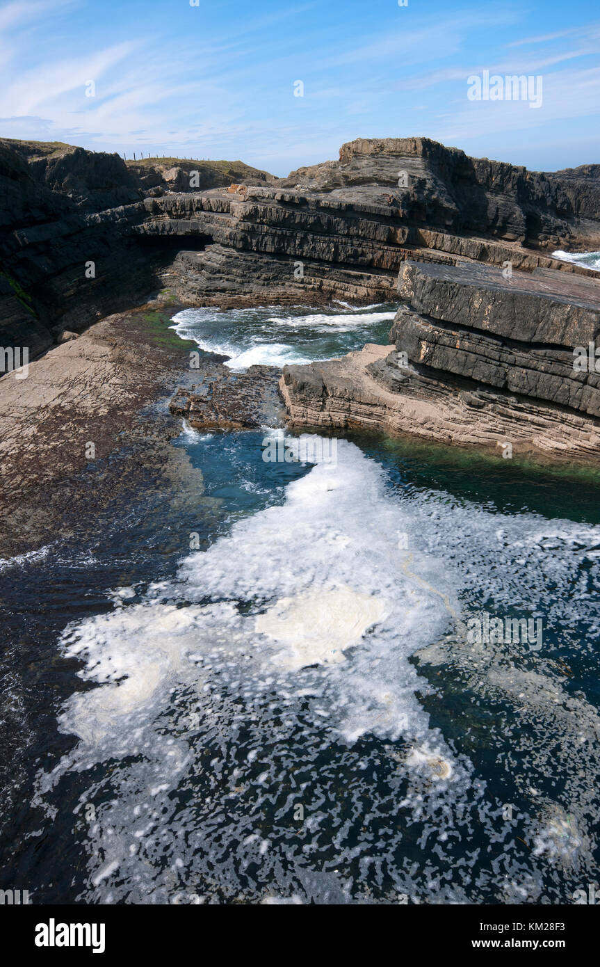 Jagged cliffs near Bridges of Ross, Loop Head peninsula, County Clare ...