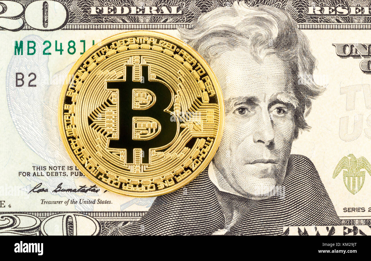 Cryptocurrency of the Bitcoin lying on the american dollar banknote ...