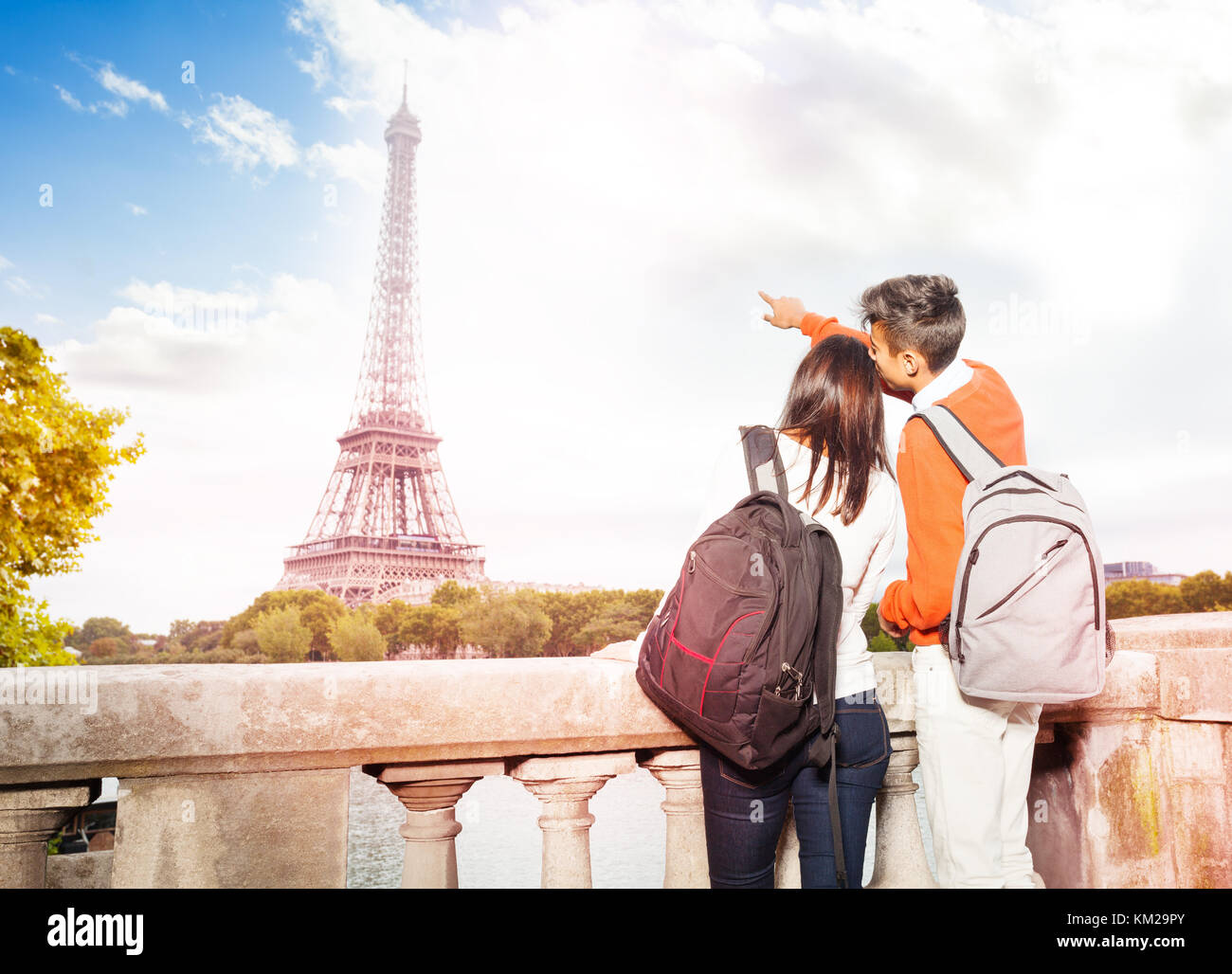 Back view of man with backpack pointing hi-res stock photography and ...
