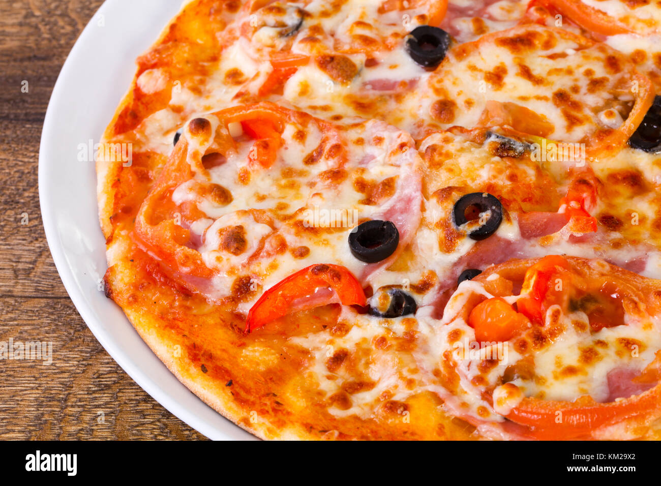 Pizza with ham and cheese Stock Photo - Alamy