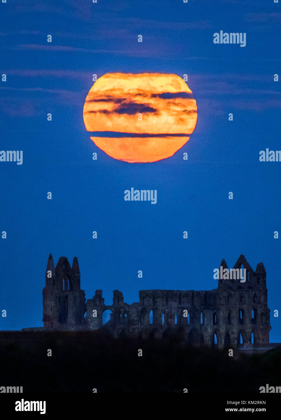 The Supermoon rises above Whitby Abbey in Yorkshire Stock Photo - Alamy