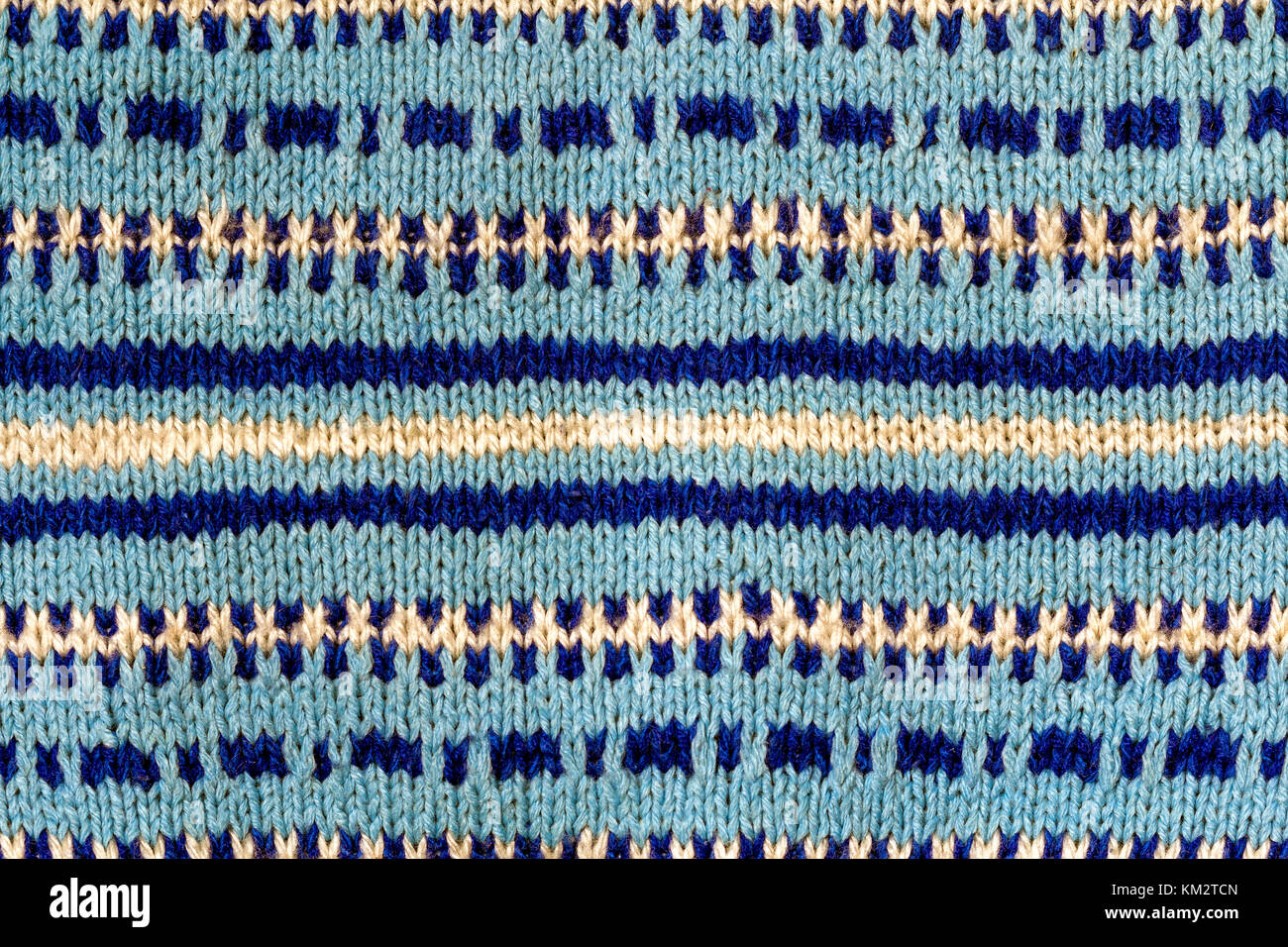 Background texture of blue pattern knitted fabric made of cotton or ...