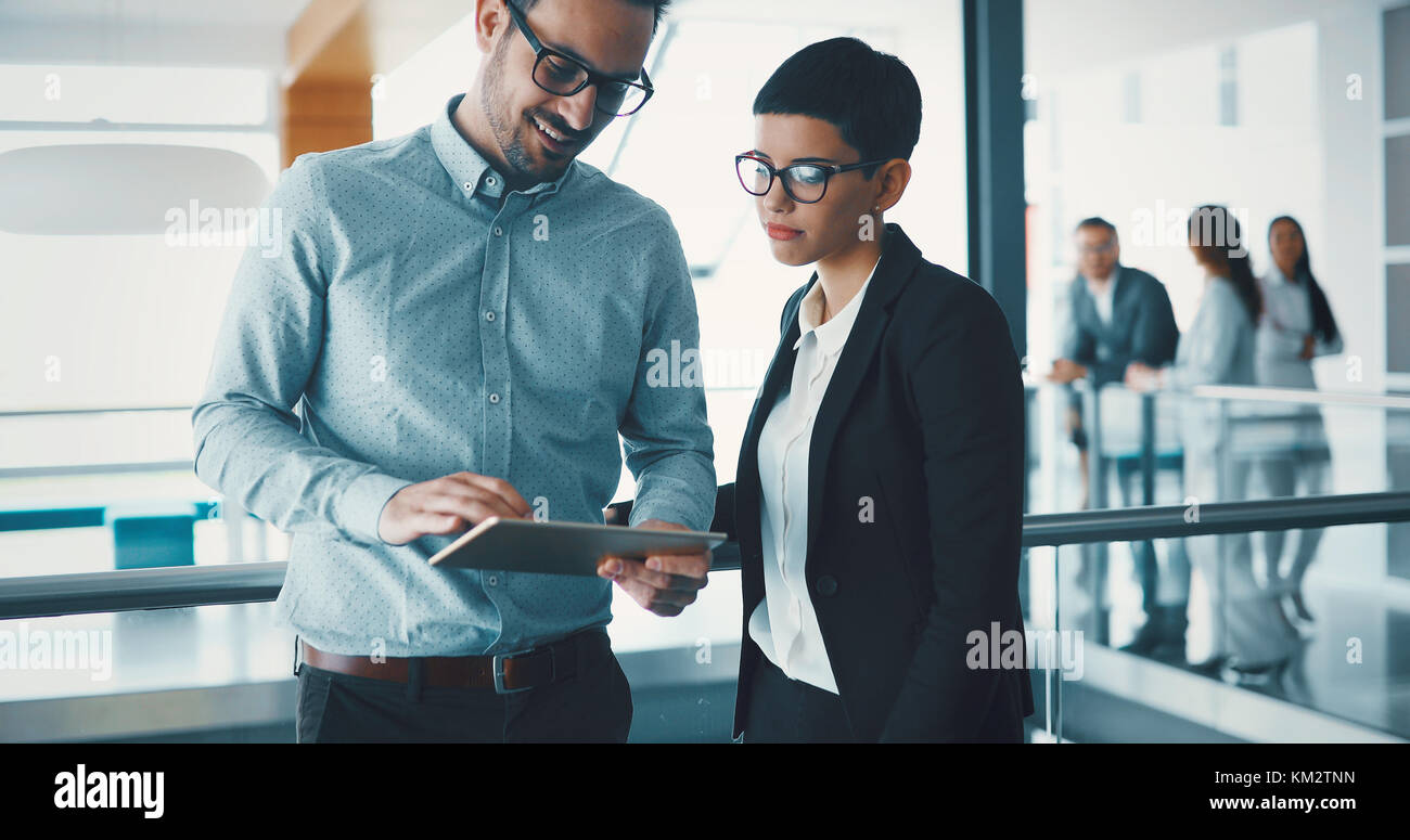 Happy business colleagues in modern office Stock Photo - Alamy