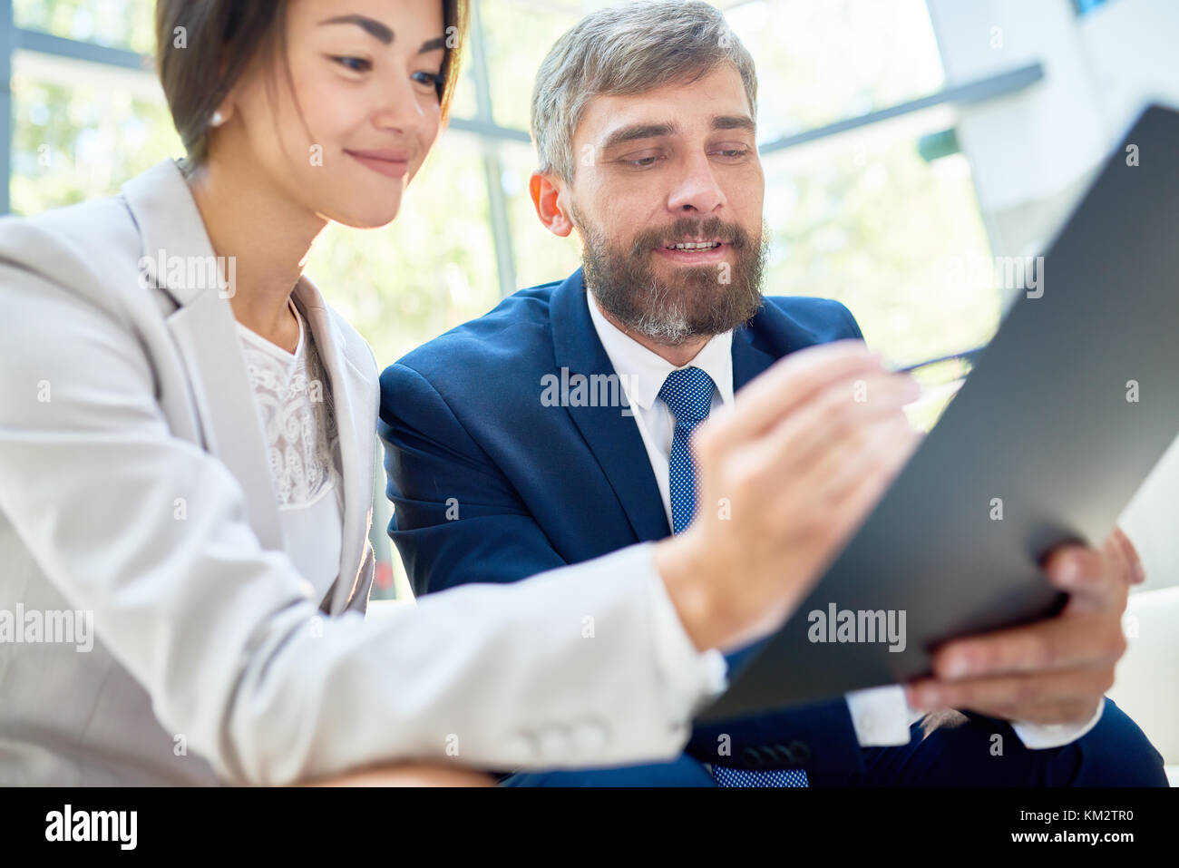 Two people signing business contract hi-res stock photography and ...