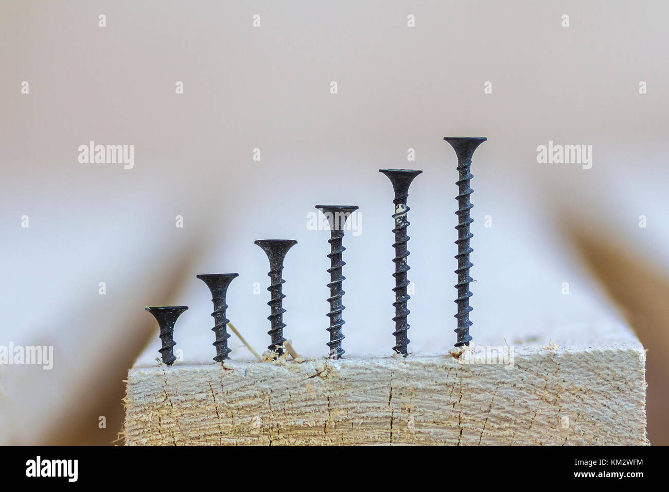 Positive graph made of screws as bar charts on board background Stock ...