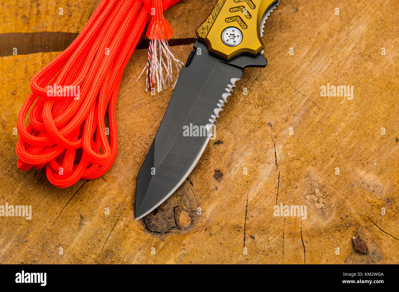 Black knife blade with a serritorial blade. Cut parachute cord Stock ...