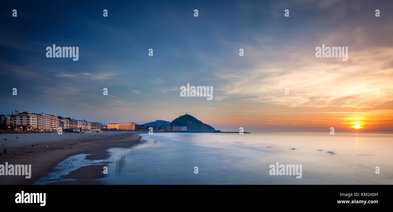 sunset over zuriola beach and mount urgull in donostia san sebastian ...