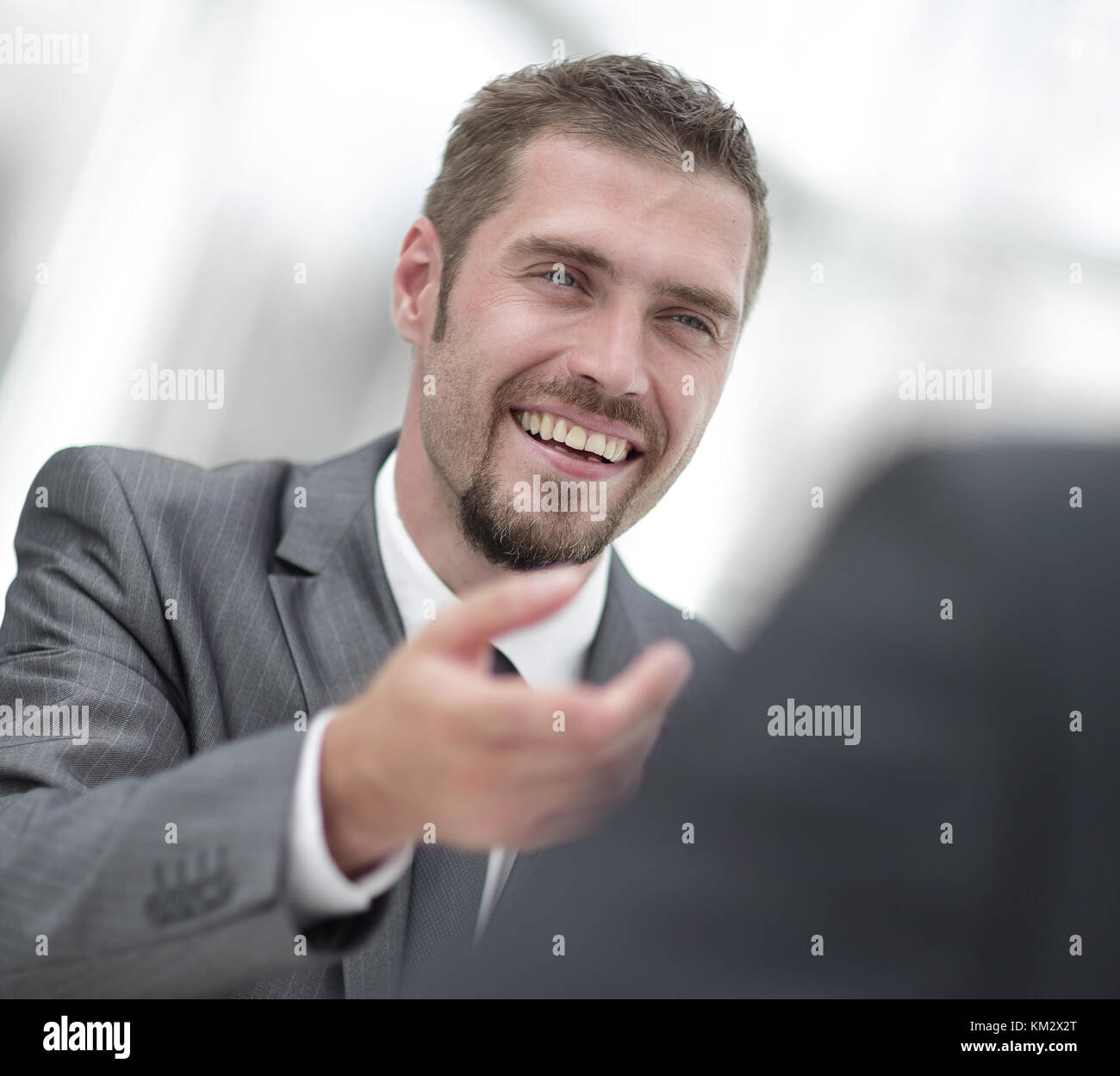 closeup.smiling businessman looking at the laptop screen Stock Photo ...