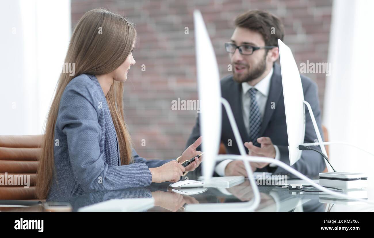 employees discuss work issues in the office Stock Photo - Alamy