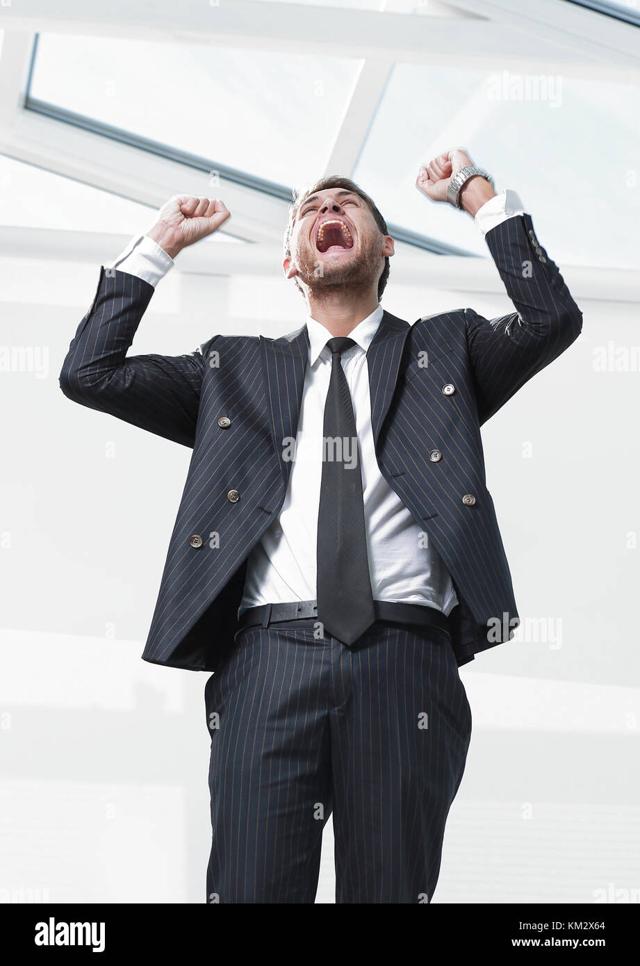portrait, triumphant businessman ,isolated on white background Stock ...
