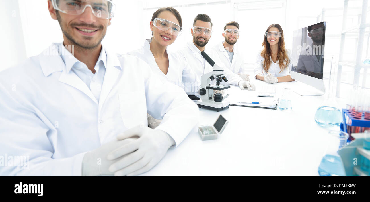 Male scientist and the team in the lab Stock Photo - Alamy