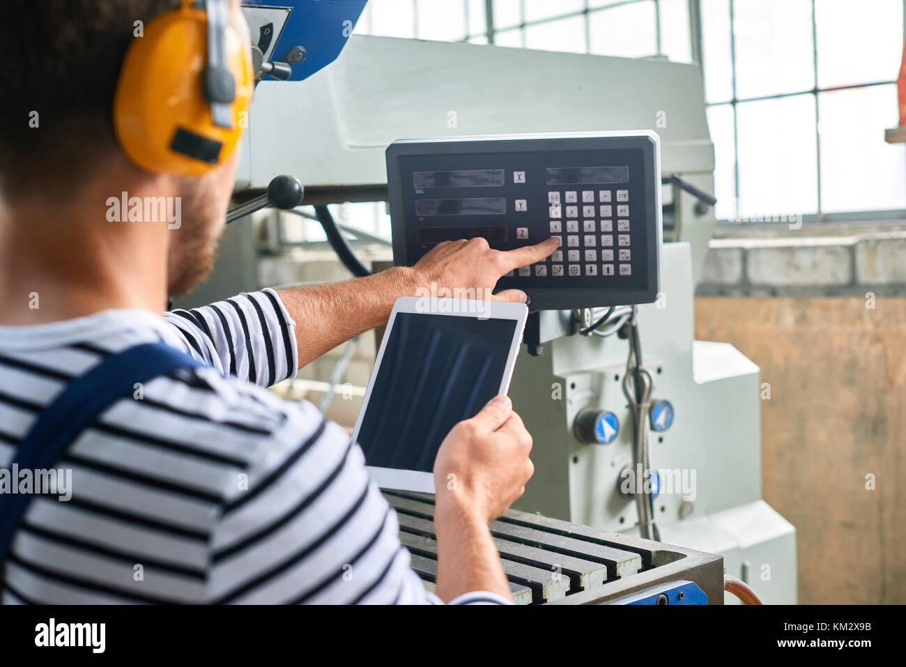 Operator Using Modern Machine Units at Plant Stock Photo - Alamy