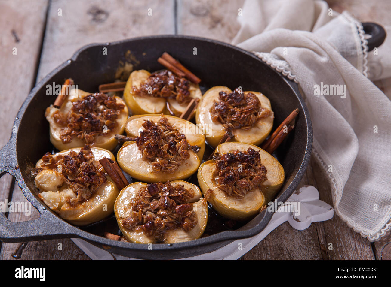 Baked apple with nuts, honey and oat flakes Stock Photo - Alamy