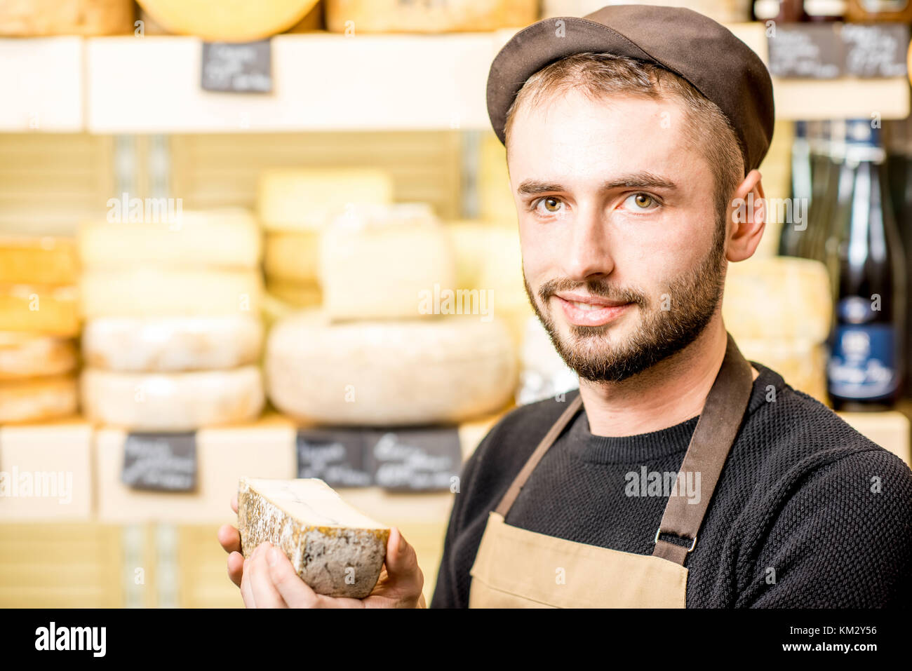 Cheese seller at the shop Stock Photo - Alamy
