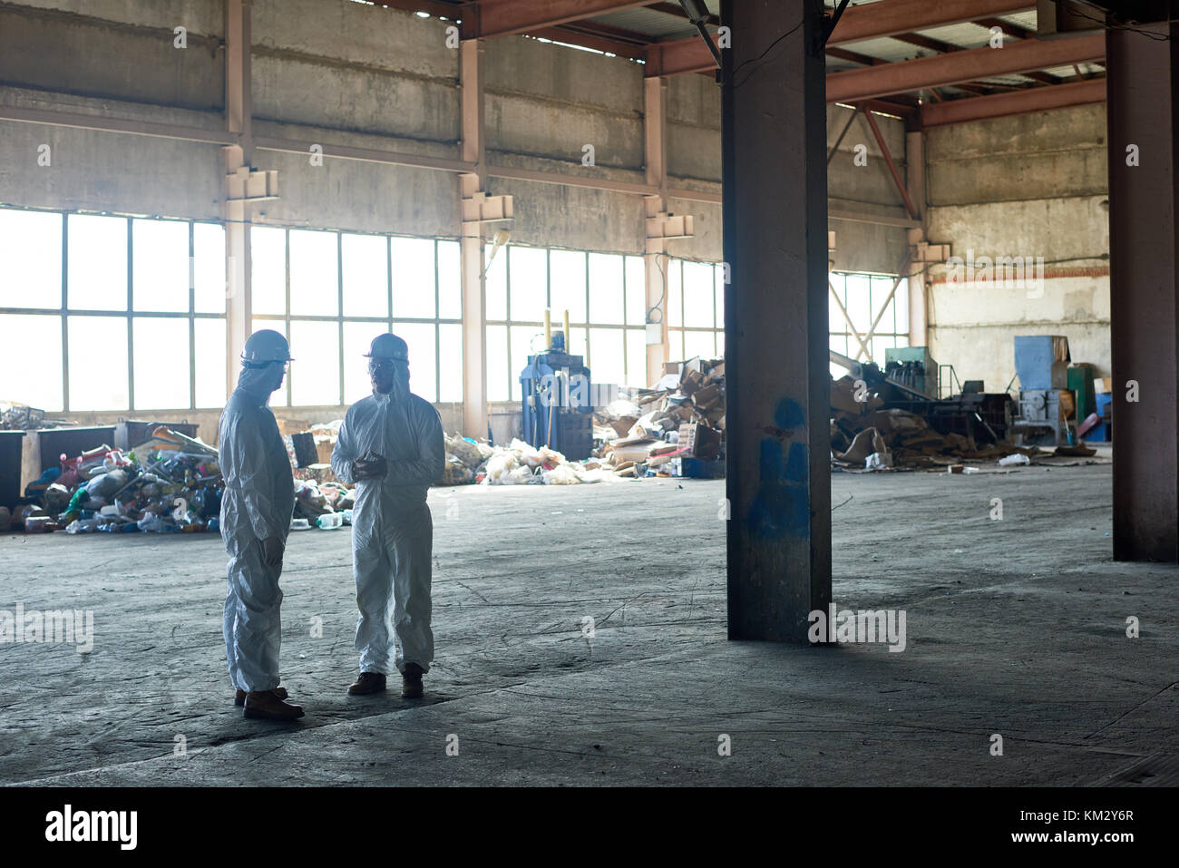 Workers in Empty Waste Processing Workshop Stock Photo - Alamy