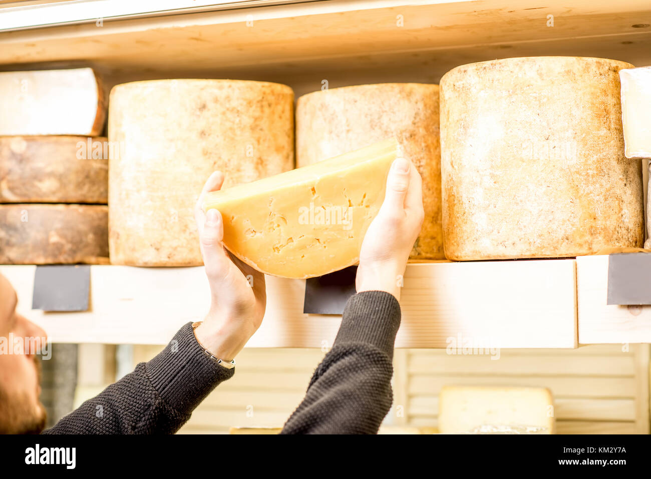 Cheese seller at the shop Stock Photo - Alamy
