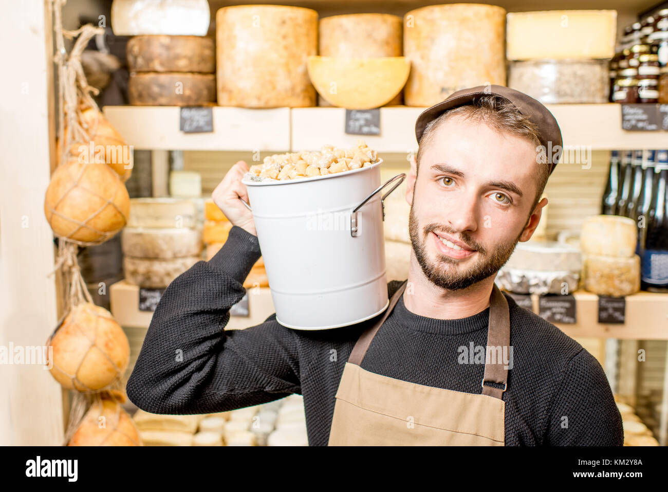 Cheese seller at the shop Stock Photo - Alamy