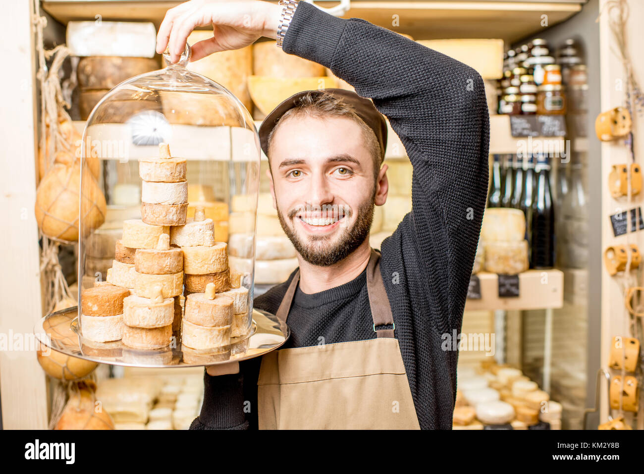 Cheese seller at the shop Stock Photo - Alamy