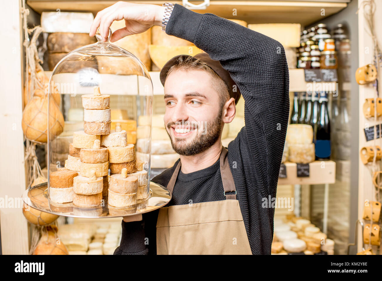 Cheese seller at the shop Stock Photo - Alamy