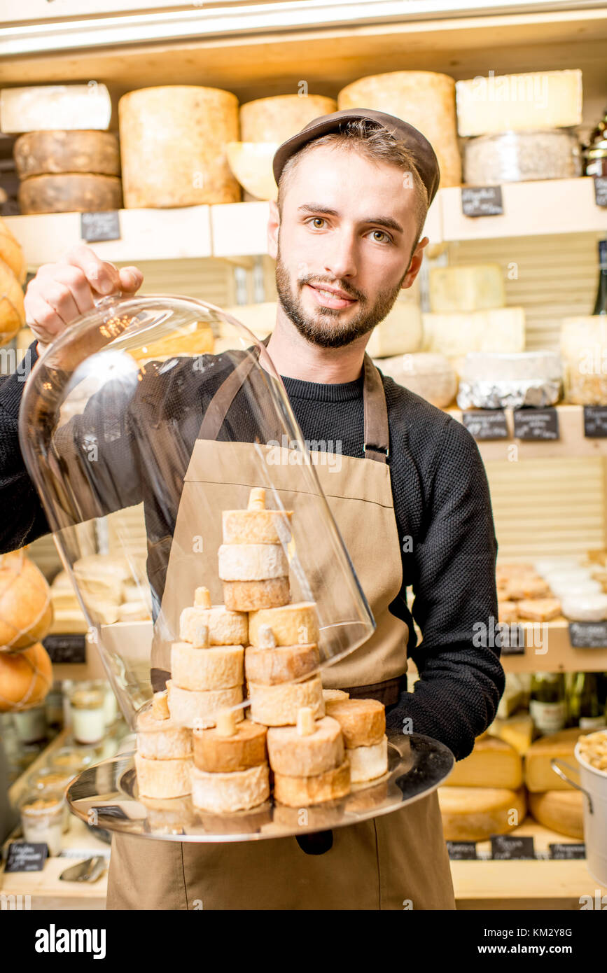Cheese seller at the shop Stock Photo - Alamy