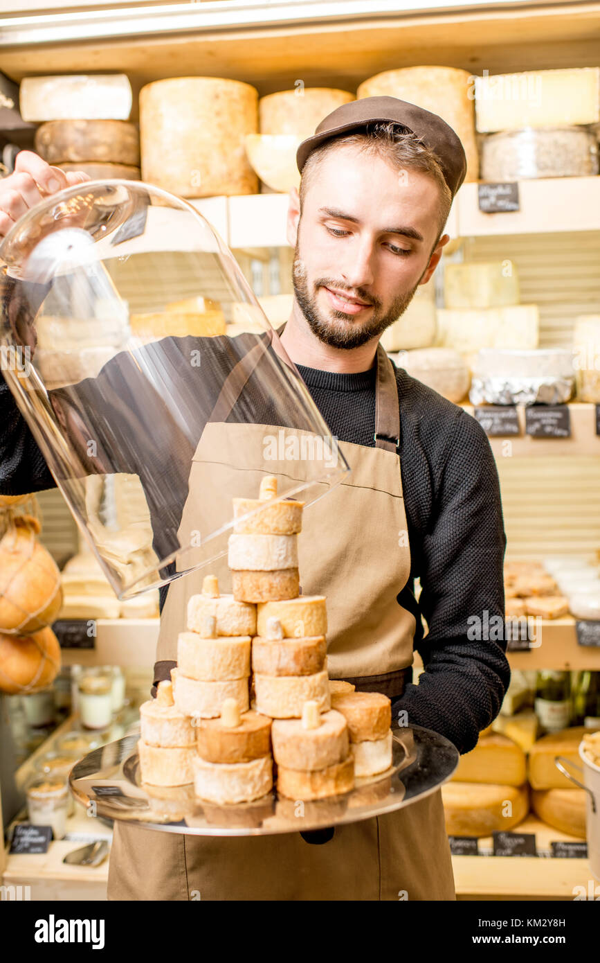 Cheese seller at the shop Stock Photo - Alamy