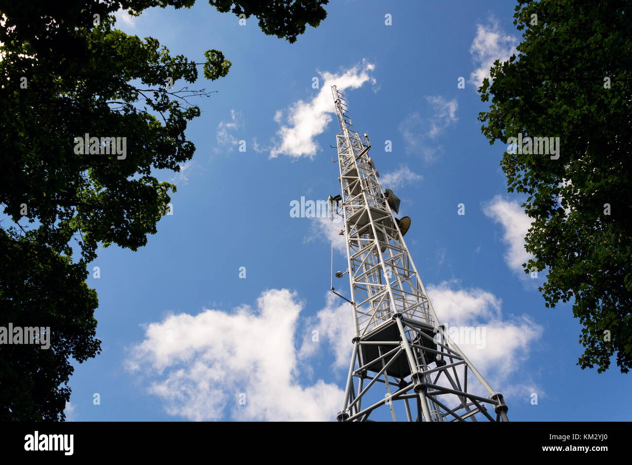 Transmitters and aerials on telecommunication tower with cloudy blue sky Stock Photo - Alamy