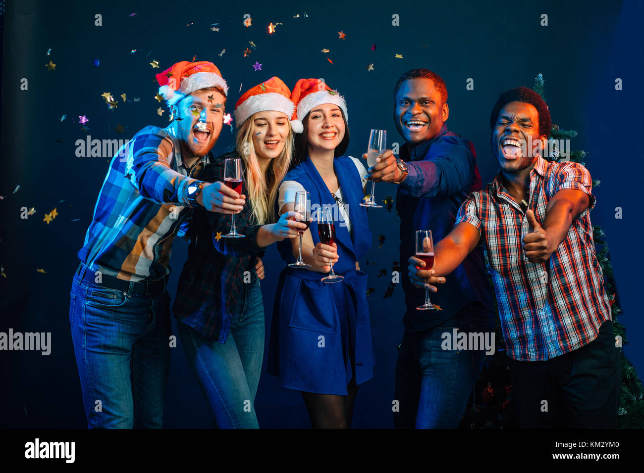 Christmas party friends at having drink and fun Stock Photo - Alamy