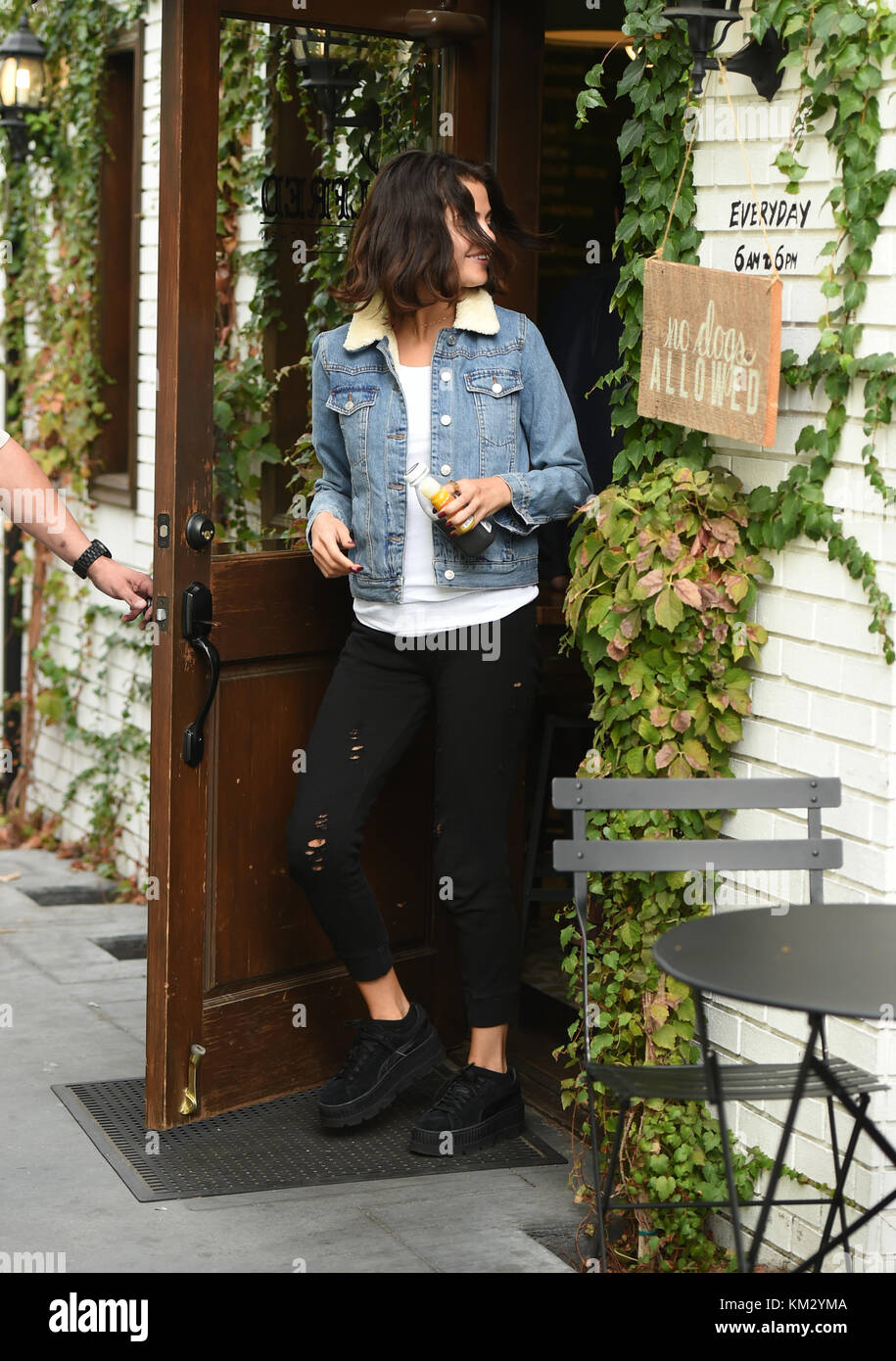 Selena Gomez goes to a coffee shop with a friend Featuring: Selena ...