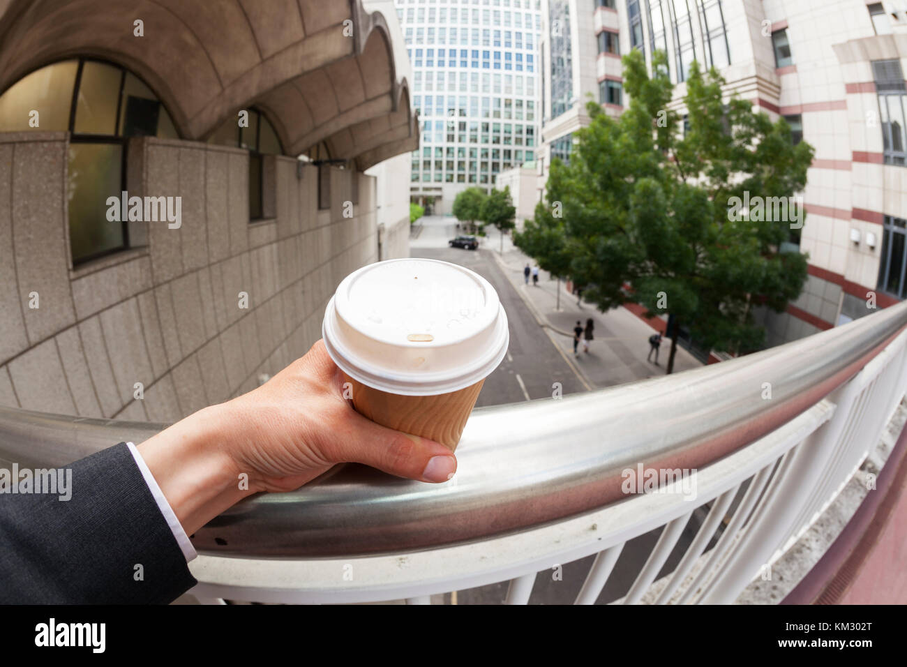 Personal perspective of a businessman drinking a cup of coffee Stock ...