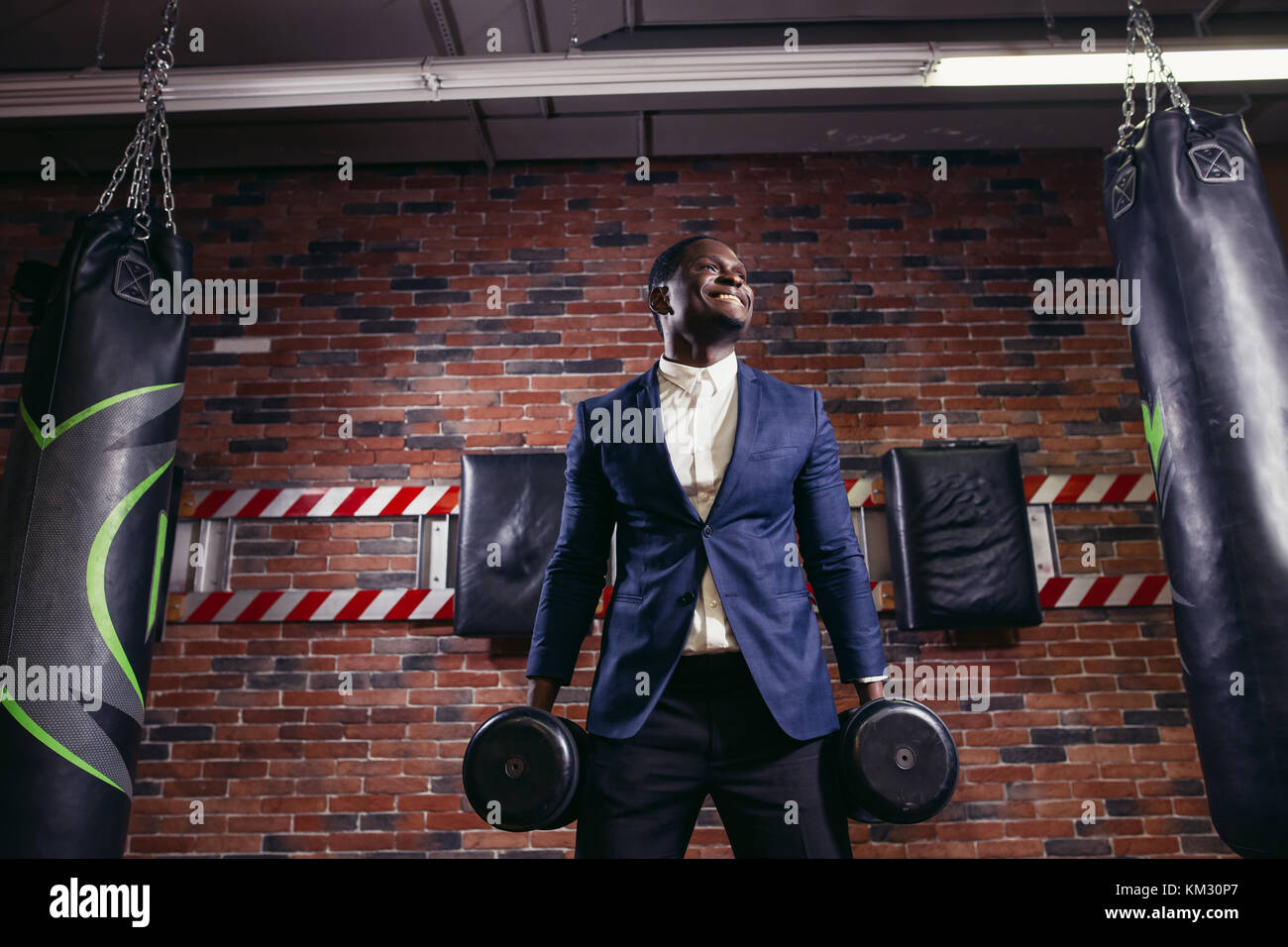 healthy african man working out with dumbbells in gym Stock Photo - Alamy