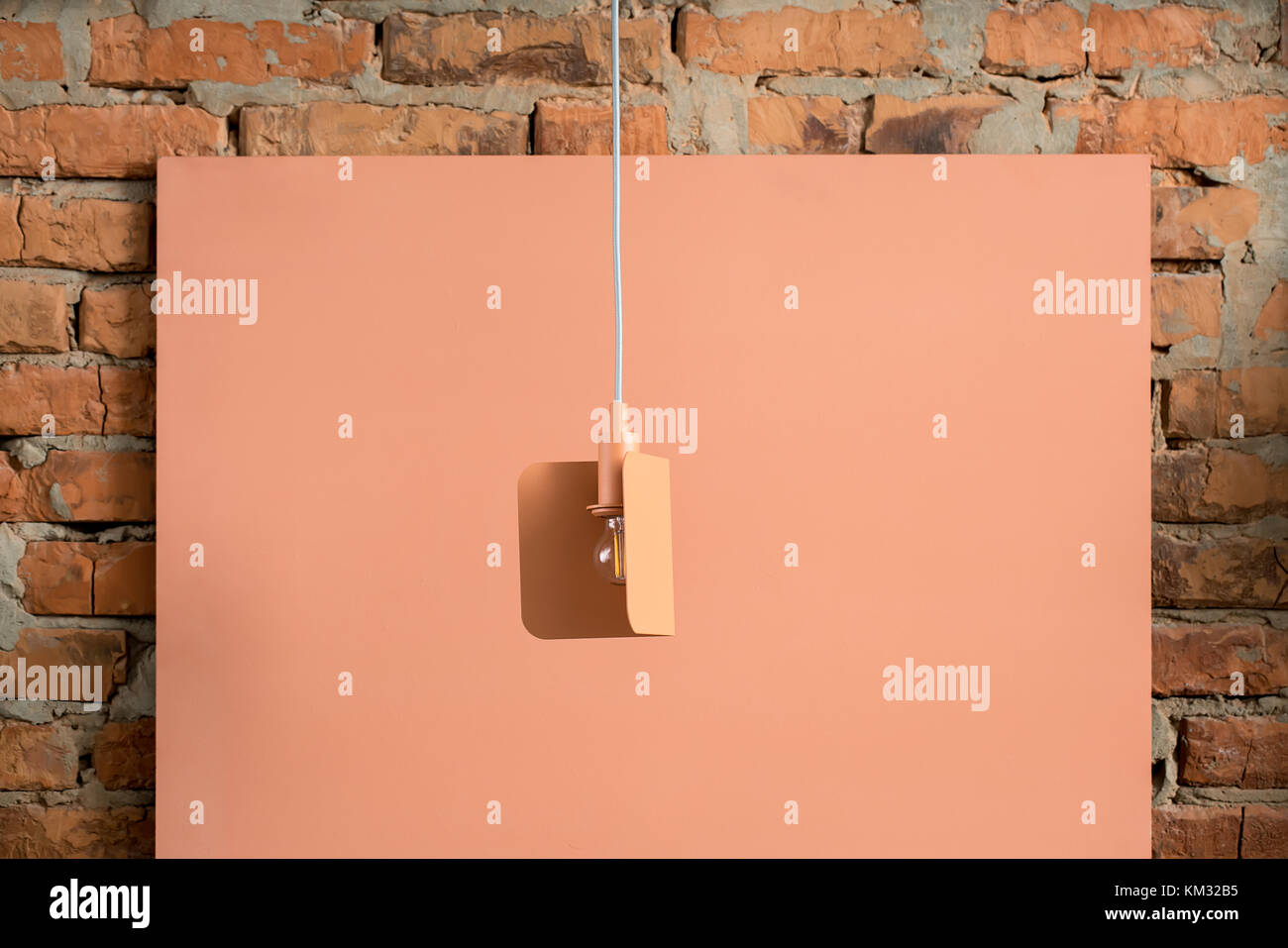 Hanging metal orange edison lamp Stock Photo - Alamy